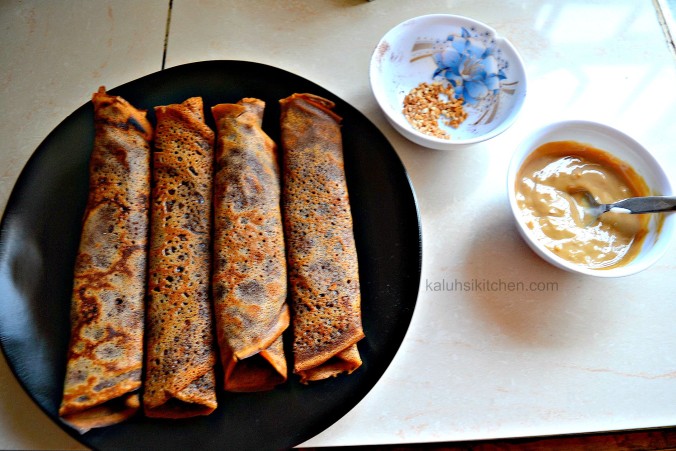 rolled up coffee crepes ready for serving and ganishing with coffee ...