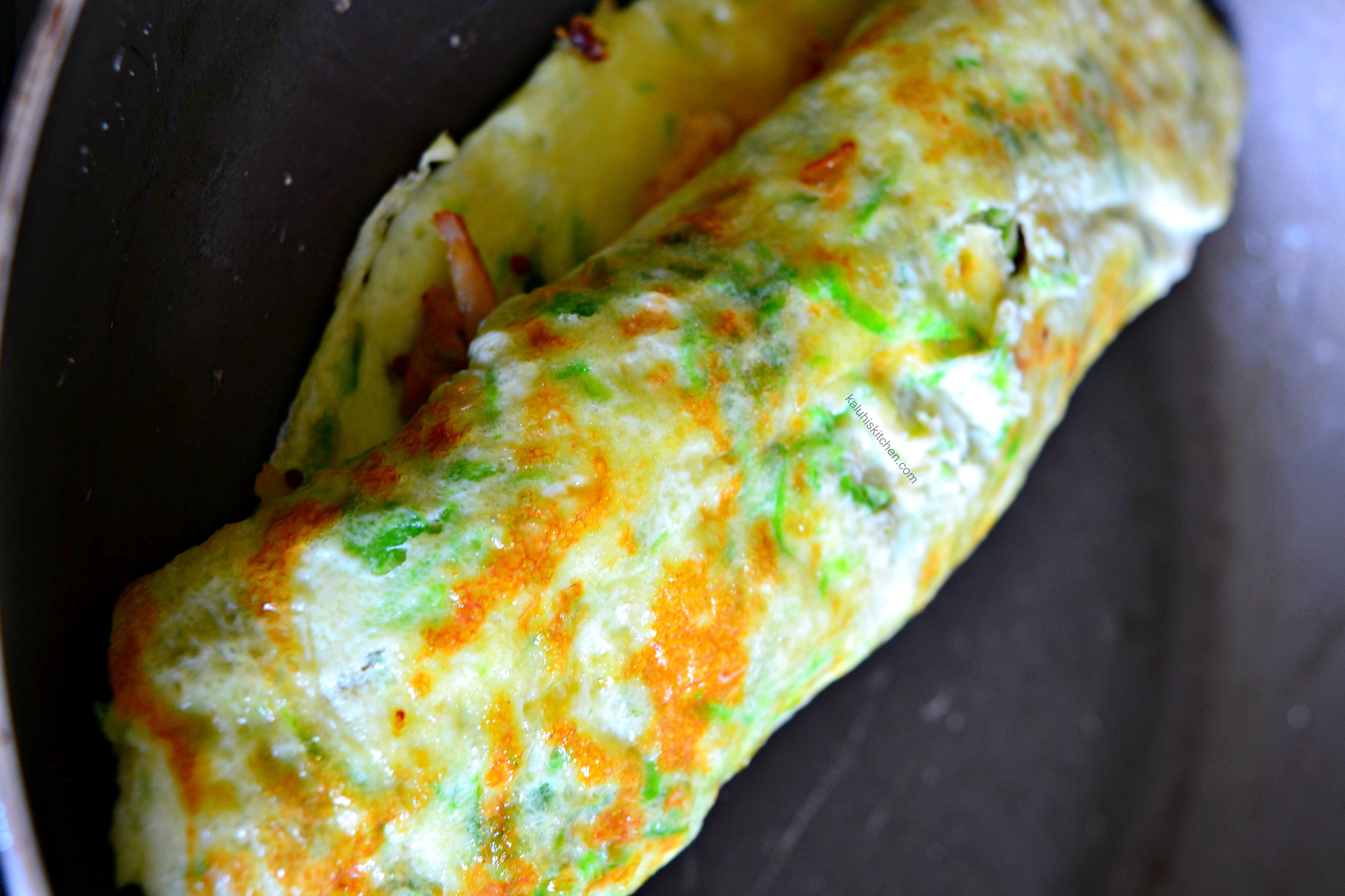 roll the omelette in one uniforn strong yet gentle motion and ahave ...